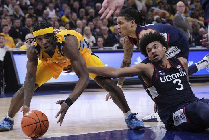Solo Ball's big night helps No. 25 UConn win 77-69 at No. 9 Marquette ...